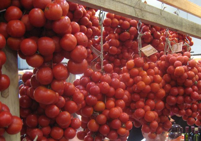 hanging tomatoes at the salone del gusto - Elizabeth Minchilli